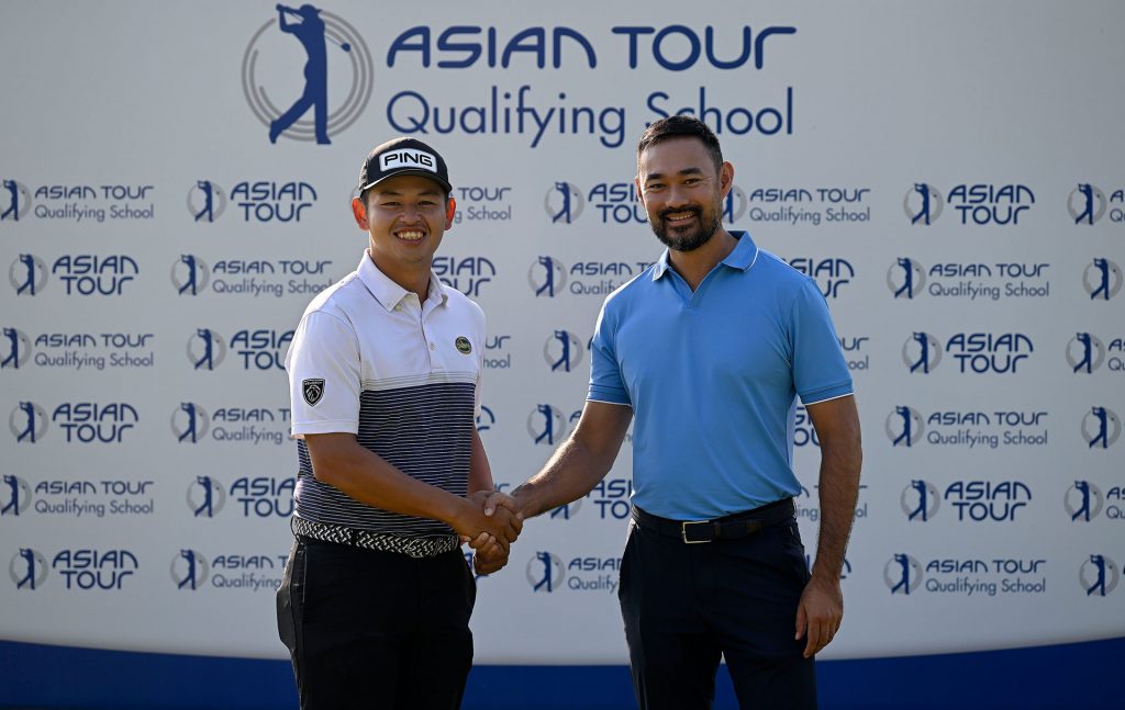 Ervin Chang of Malaysia is congratulated by Cho Minn Thant ...